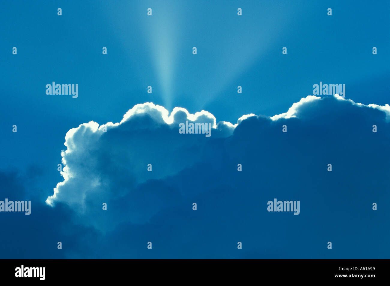 sunrays breaking through clouds Stock Photo - Alamy
