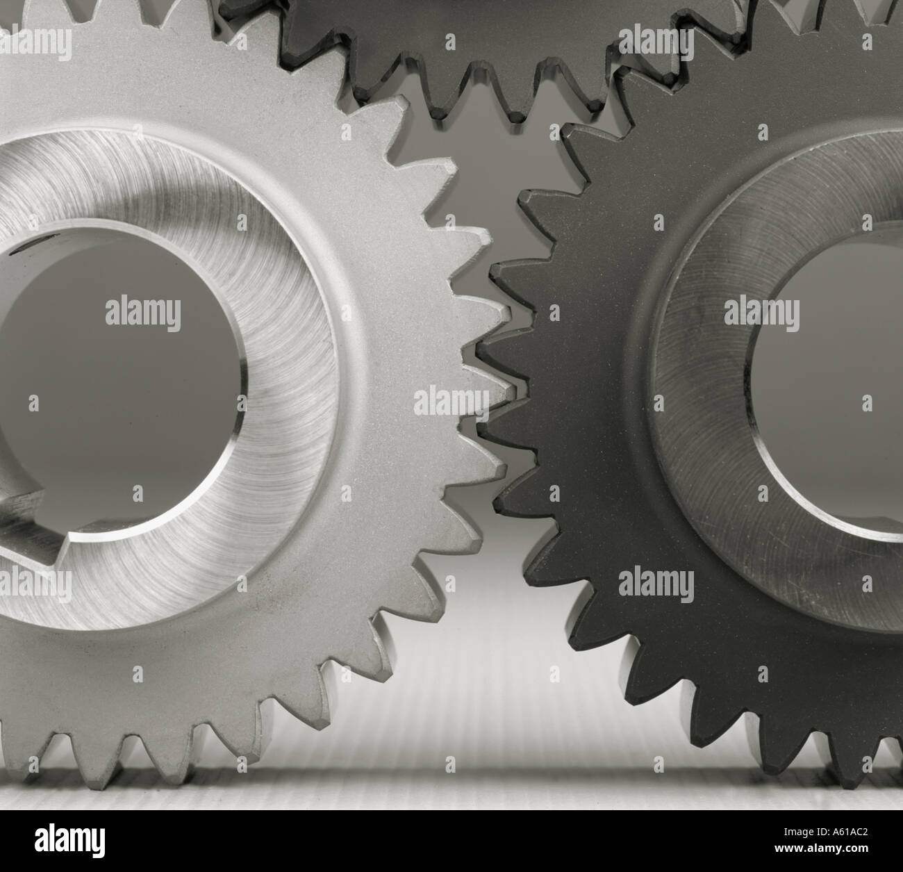 Synchronized gears connected Stock Photo - Alamy
