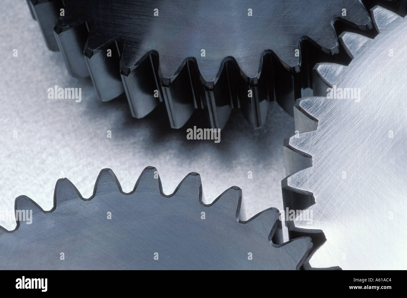 Synchronized gears connected Stock Photo - Alamy