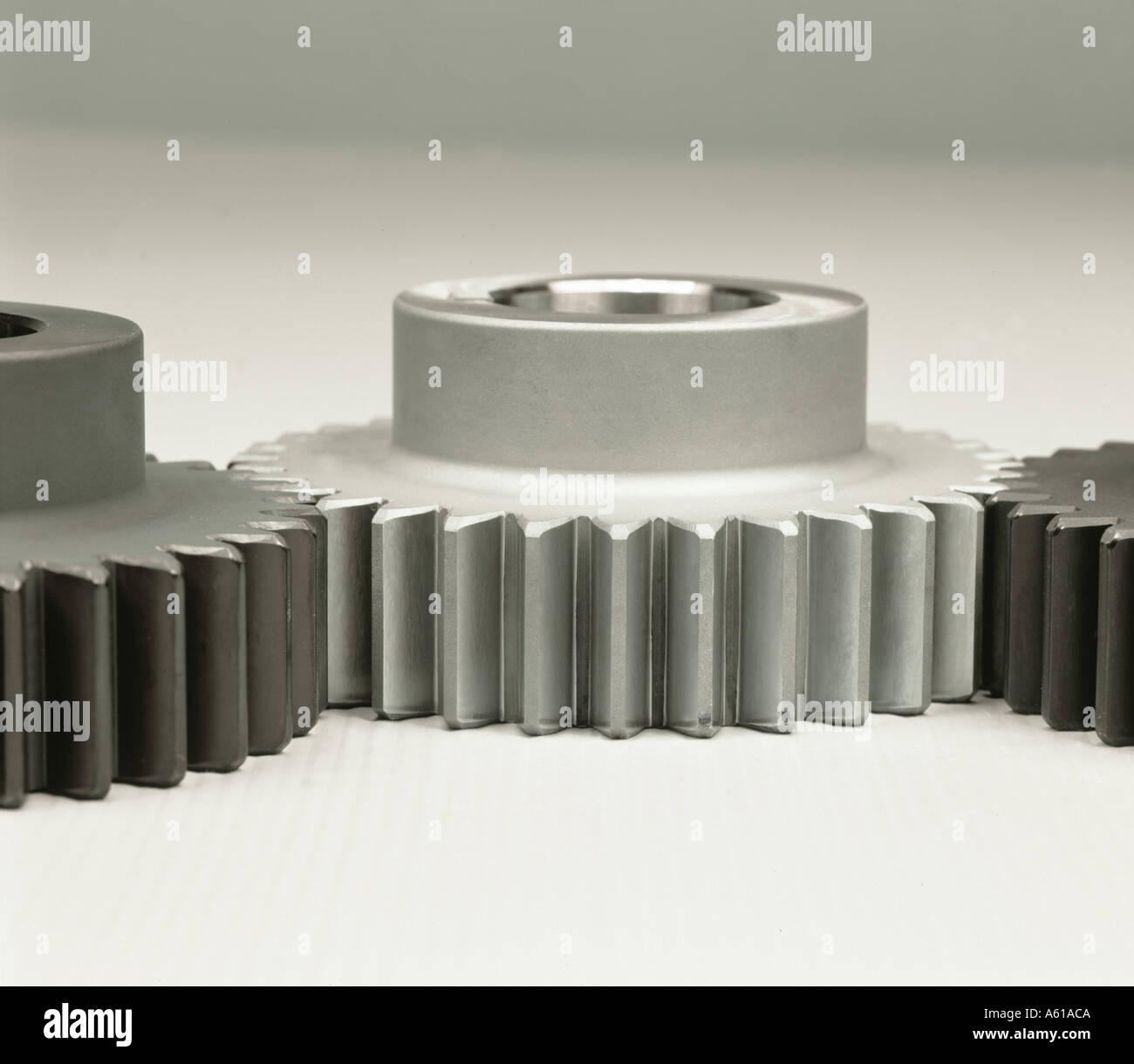 Synchronized gears connected Stock Photo - Alamy