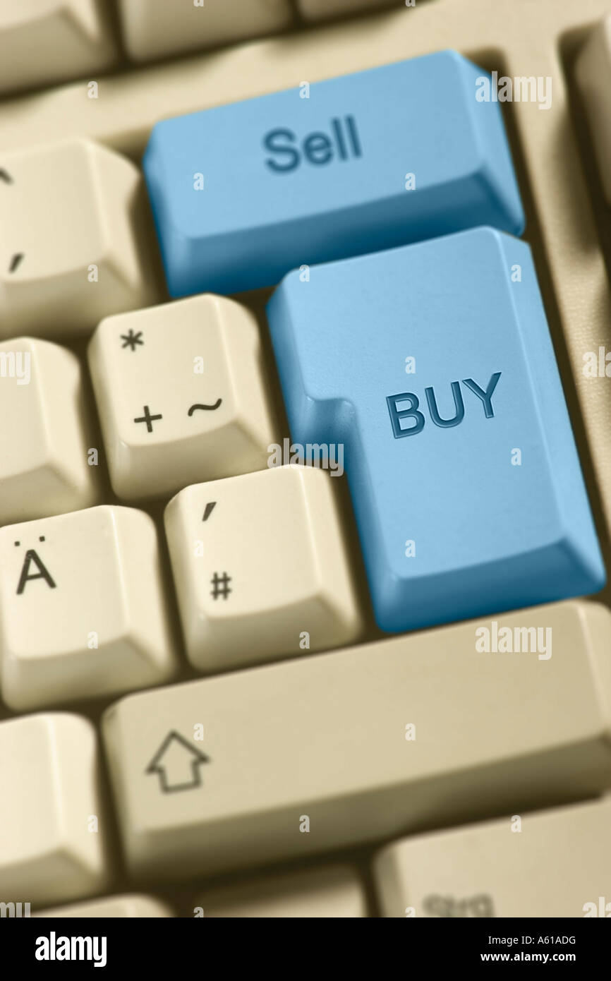"sell" and "buy" key on computer keyboard Stock Photo - Alamy