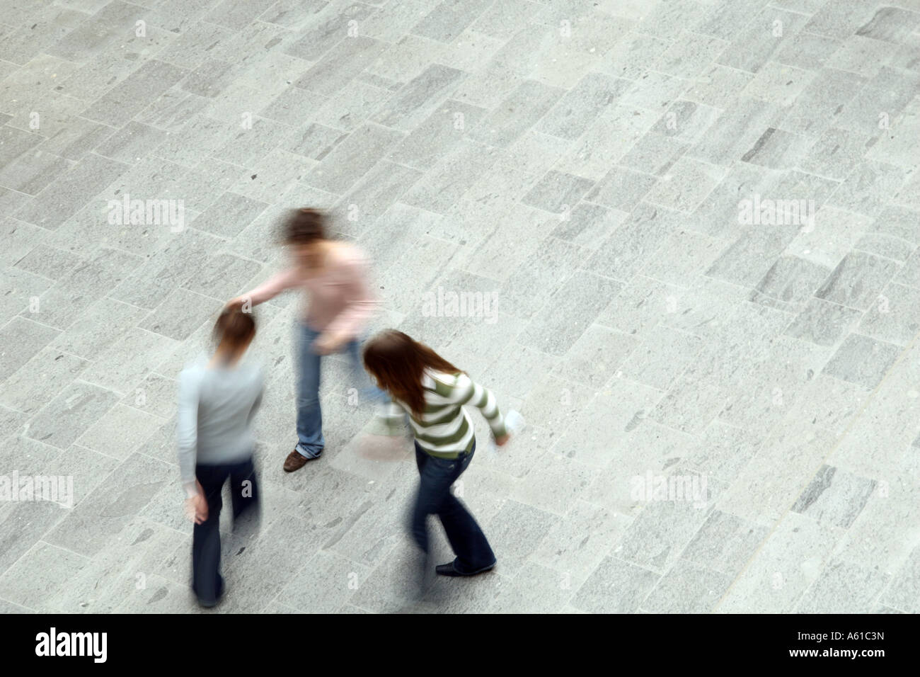 Three girls playing, blurred Stock Photo - Alamy