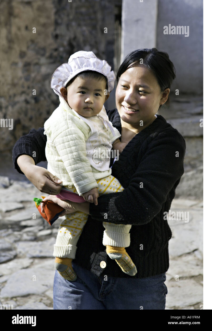 CHINA Chuandixia Young mother holds her beautiful baby daughter in the ...