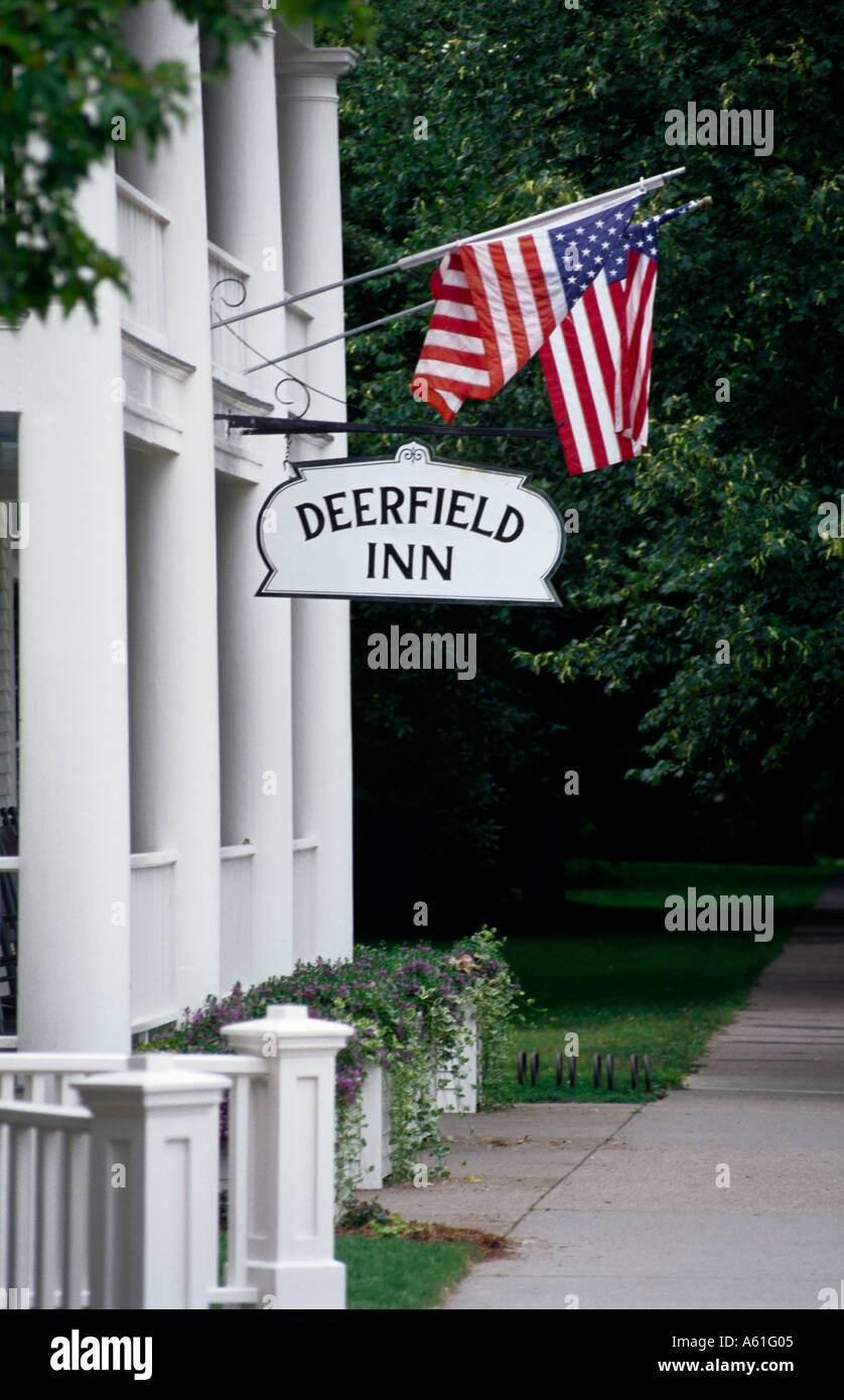 Stars and Stripes flags waving at the entrance to the Deerfield Inn ...