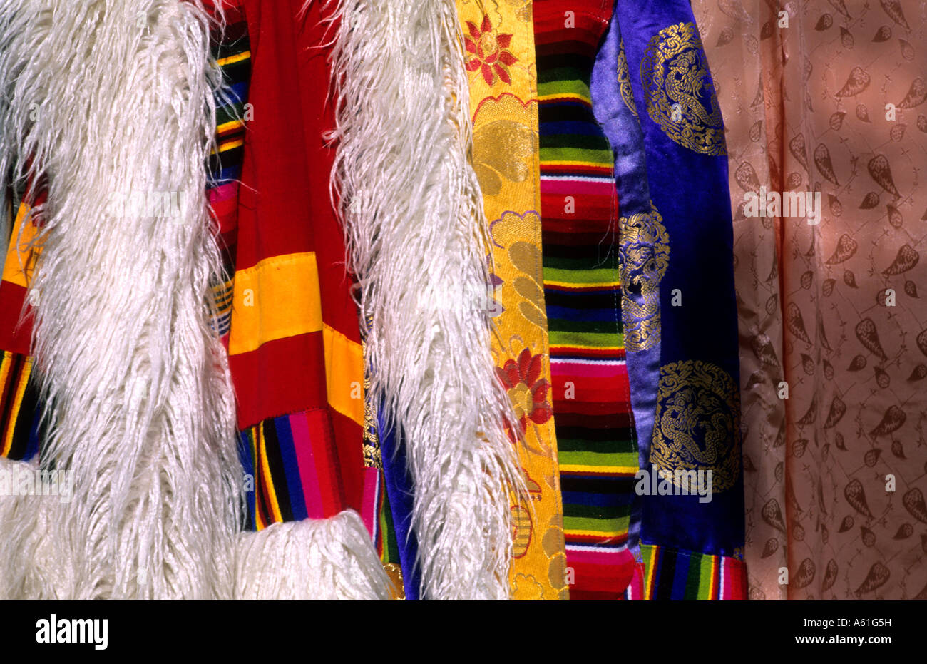Artwork and silk fabrics in the city of Lhasa Tibet China Stock Photo ...