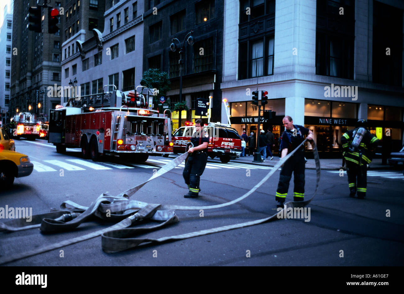 Fireman with hose new york hi-res stock photography and images - Alamy