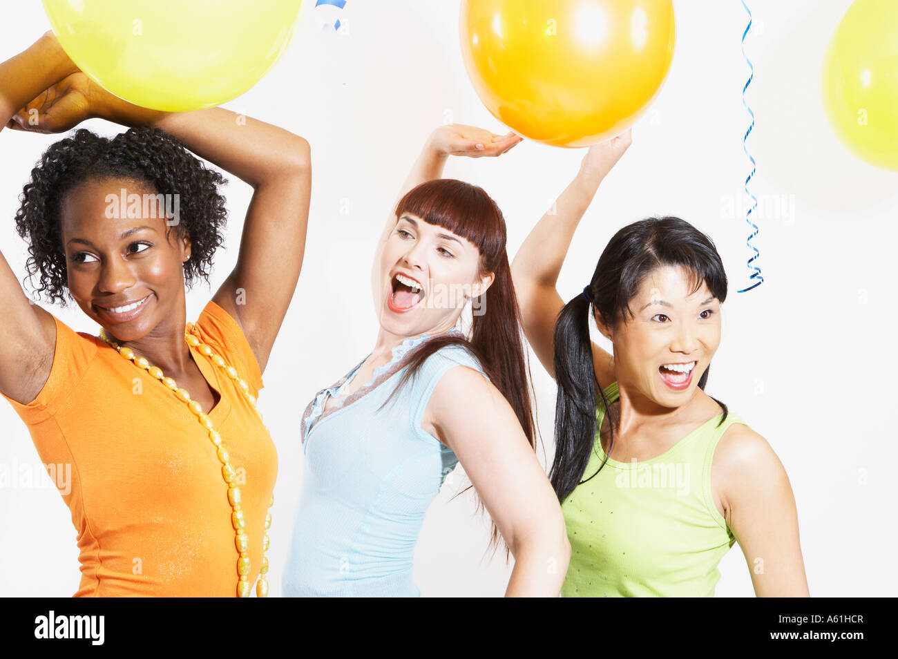 Three women dancing at party Stock Photo - Alamy