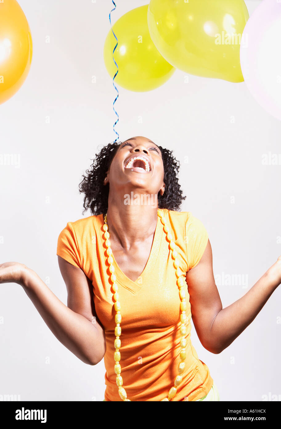 African woman laughing at party Stock Photo - Alamy