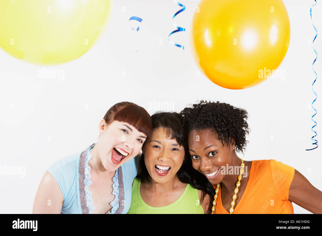 Three women smiling at party Stock Photo - Alamy