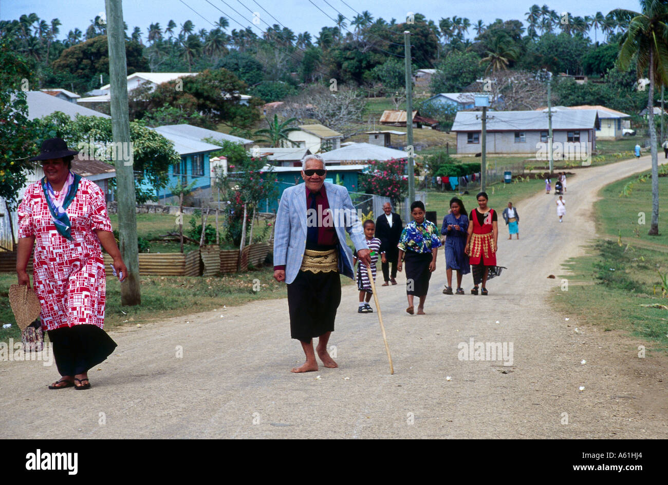 Native people walking on village street, Tonga Stock Photo - Alamy