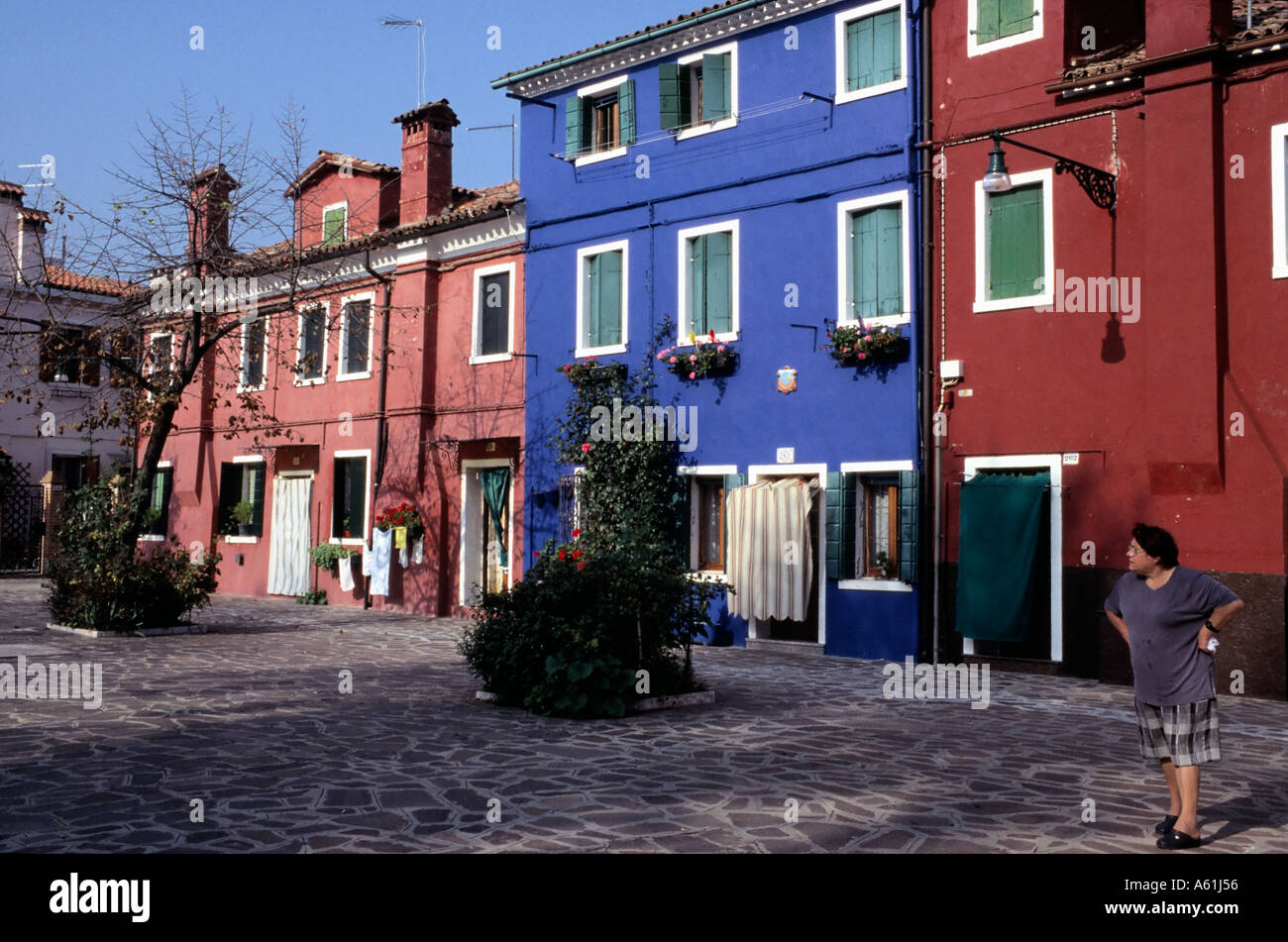 Middle aged woman waiting at the front of a villa on the Island of ...
