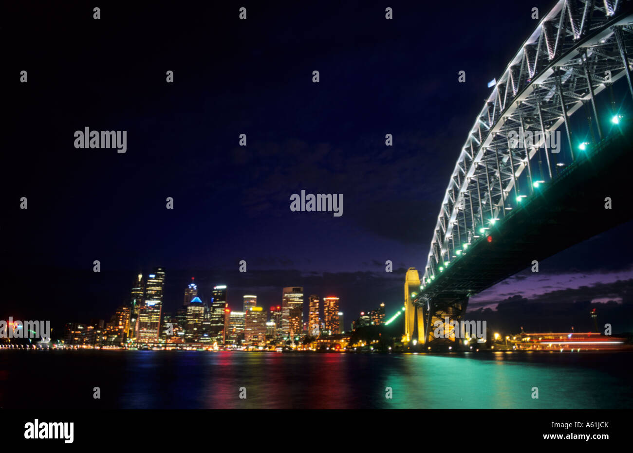 Night time photograph of the grand harbour Bridge and the city of ...