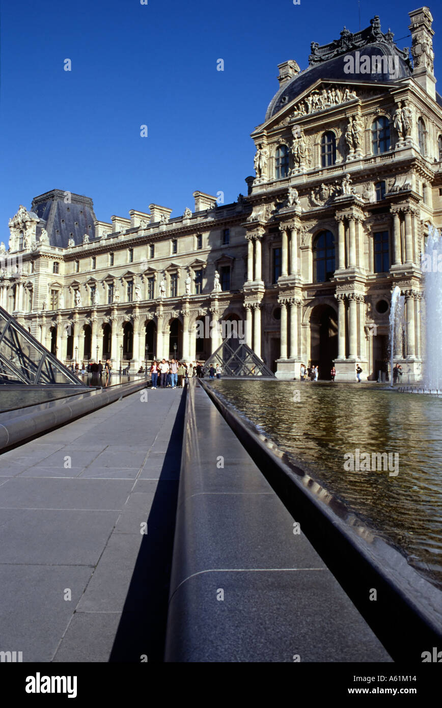 Paris Le Louvre Path between water features leading to building ...