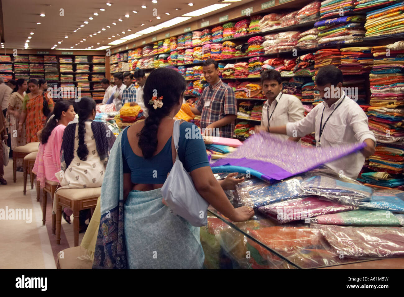Women looking at sarees in Pothys textile store Panagal Park Chennai ...