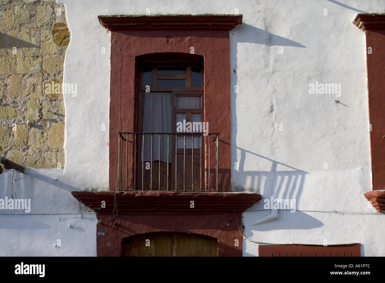 Mexico Oaxaca Morning sun lights grated window in restored Spanish ...