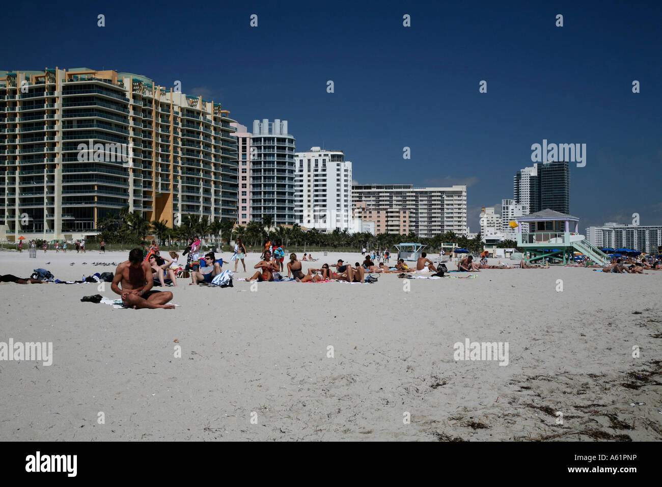 USA Florida Miami Beach with Hotels and sun worshipers Sand beach with ...