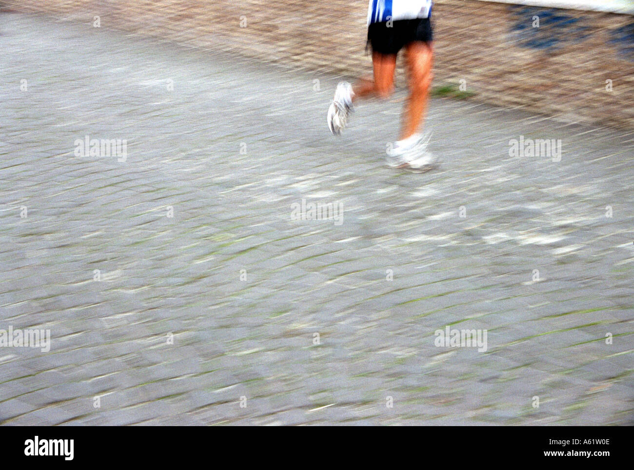 jogger s feet running on road blur Stock Photo - Alamy