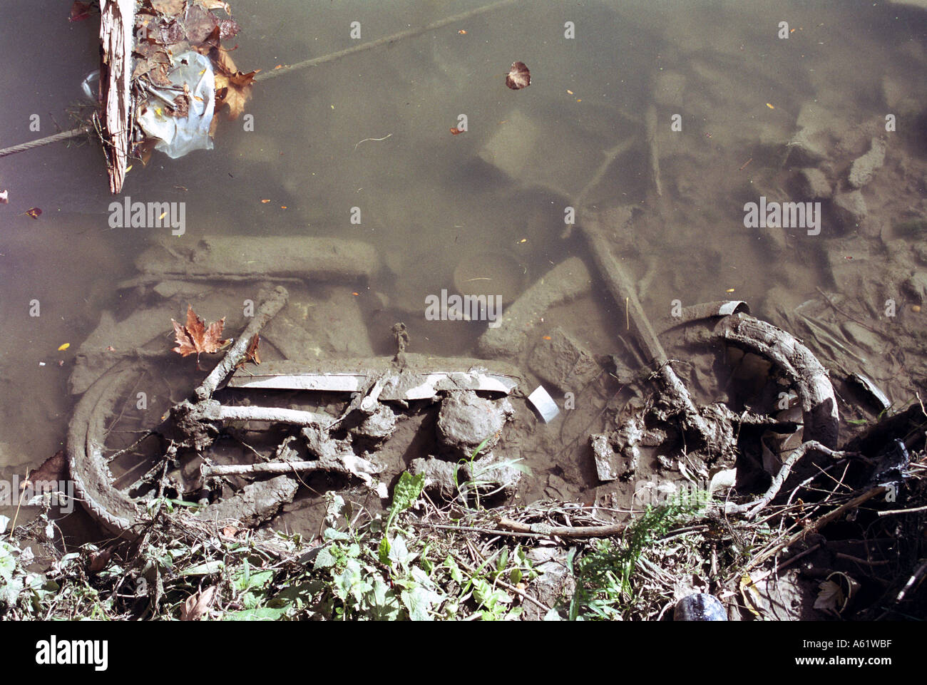abandoned moped covered in mud on river bed Stock Photo - Alamy