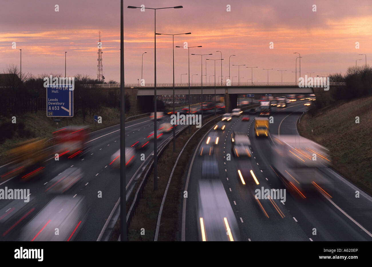 traffic travelling on the M62 motorway at sunset Leeds Yorkshire UK ...