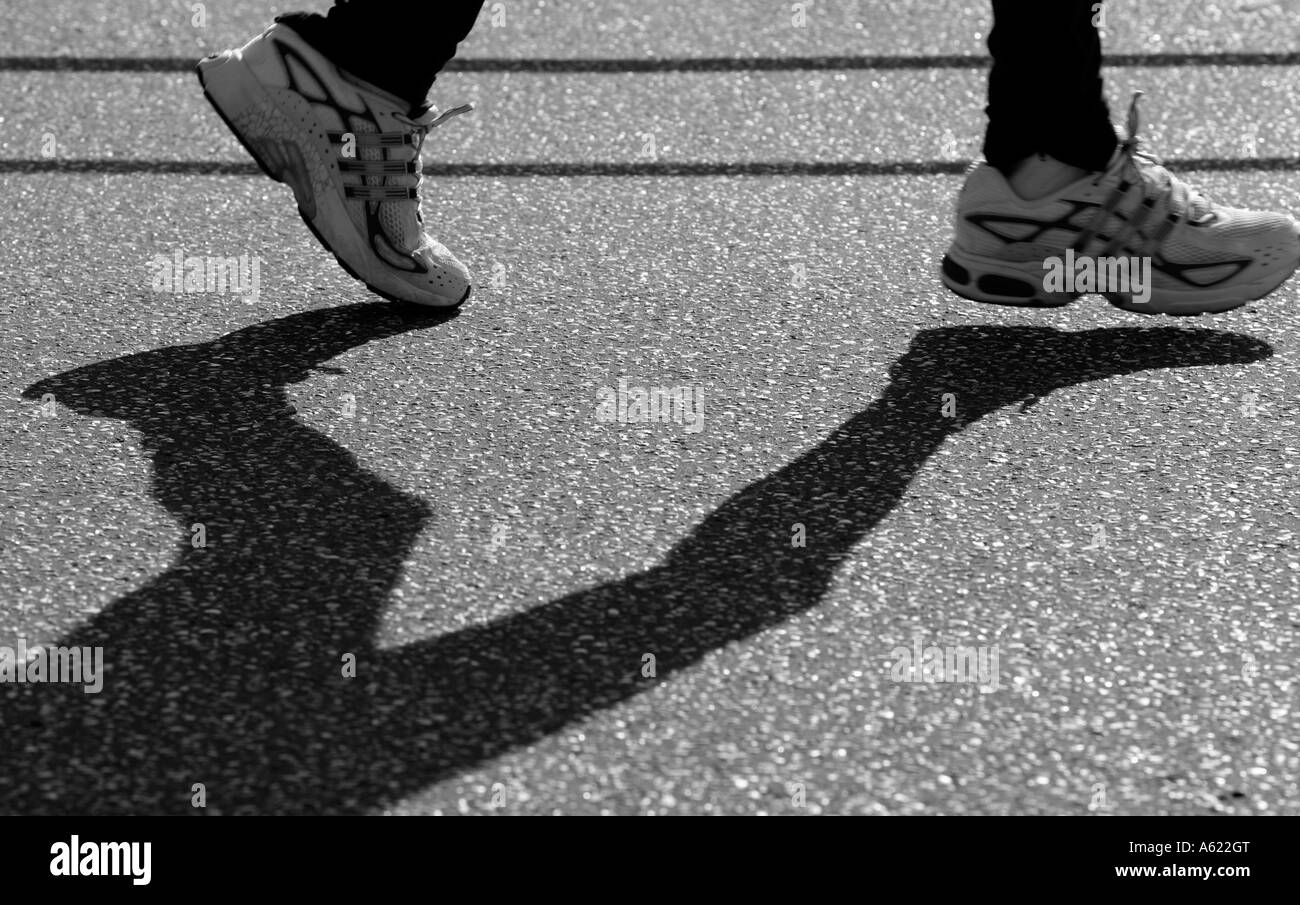 Two monochrome running feet wearing trainers Stock Photo - Alamy