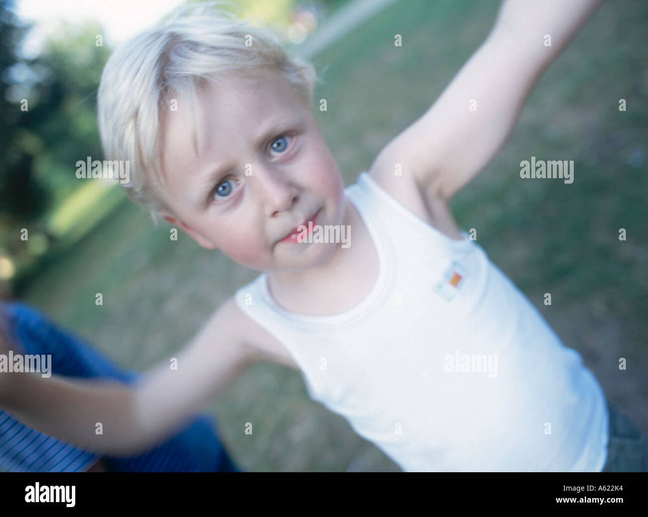 Portrait of a boy looking sceptical Stock Photo - Alamy