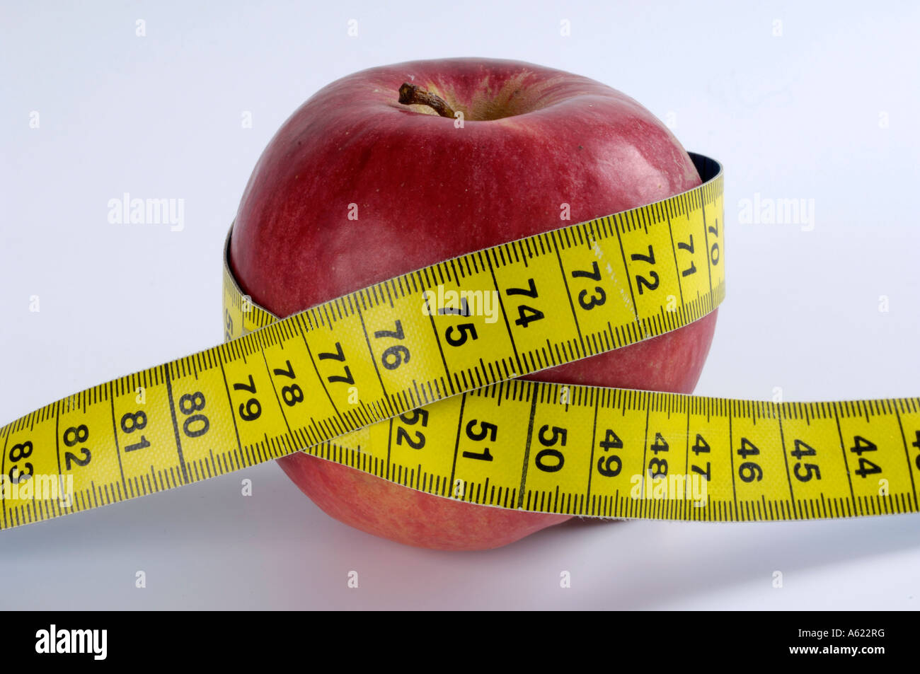 Apple with tape measure Stock Photo - Alamy