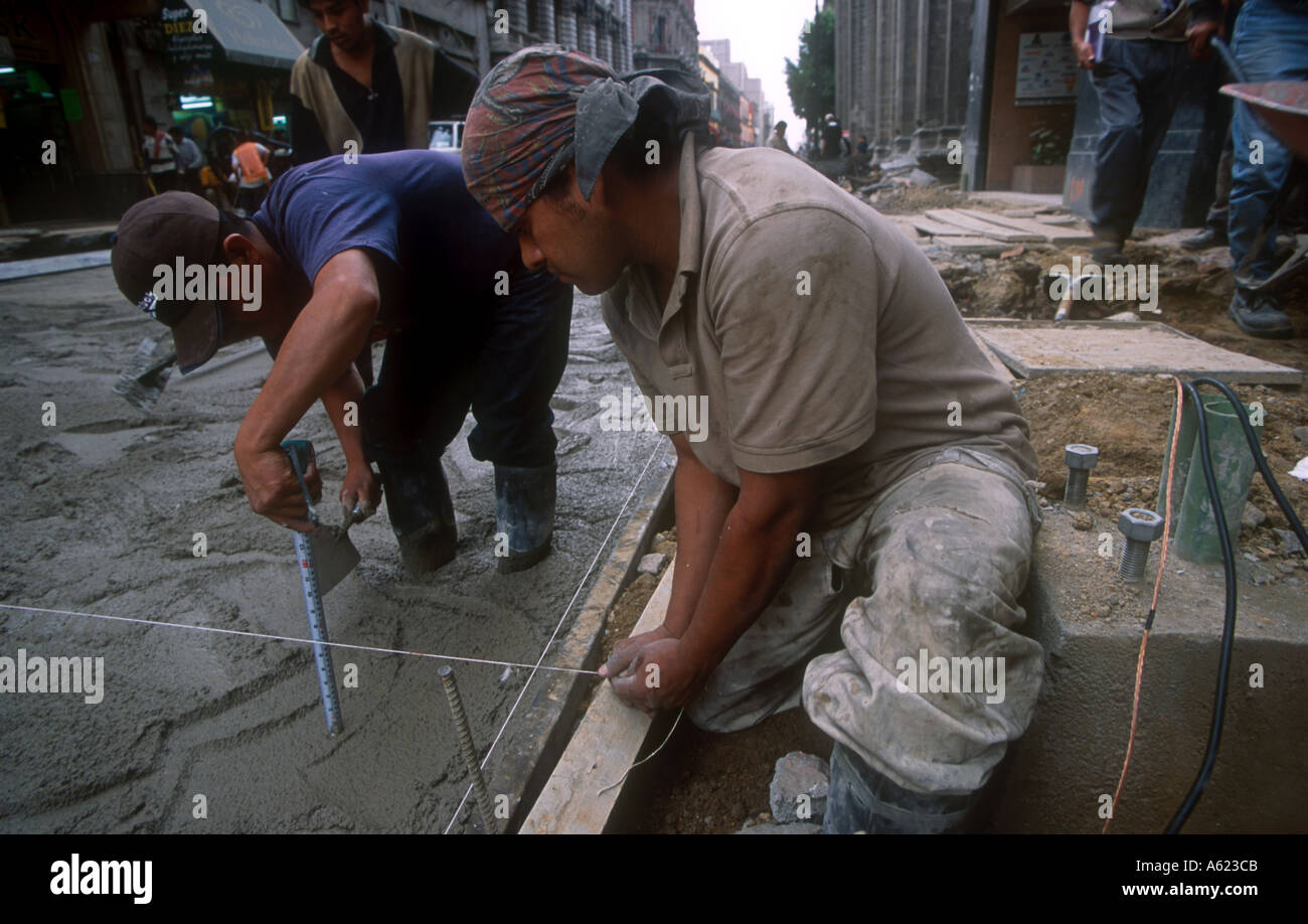MEXICO Mexico City Construction workers laying concrete on building ...