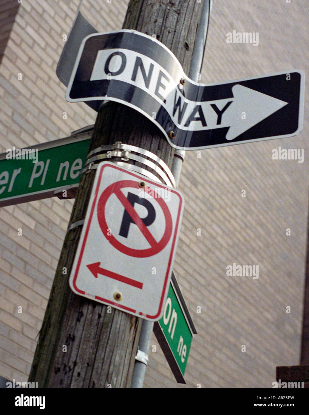 Bent one way sign Stock Photo - Alamy