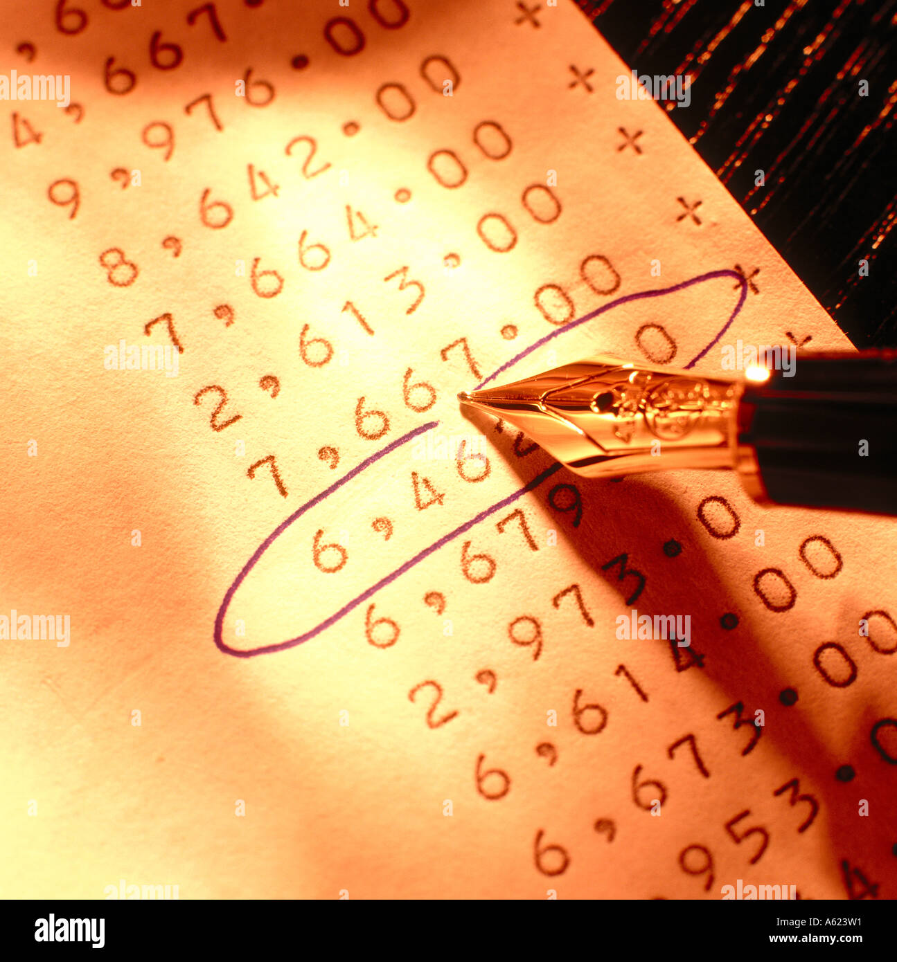 Pen circling numbers around bill Stock Photo - Alamy