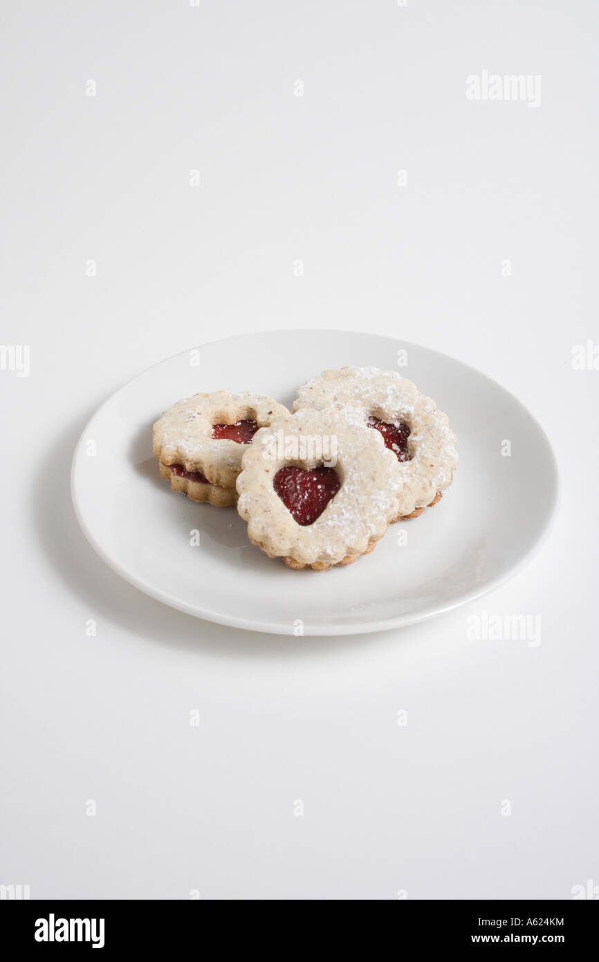 heart and star sugar cookies on white plate shot from above and front ...