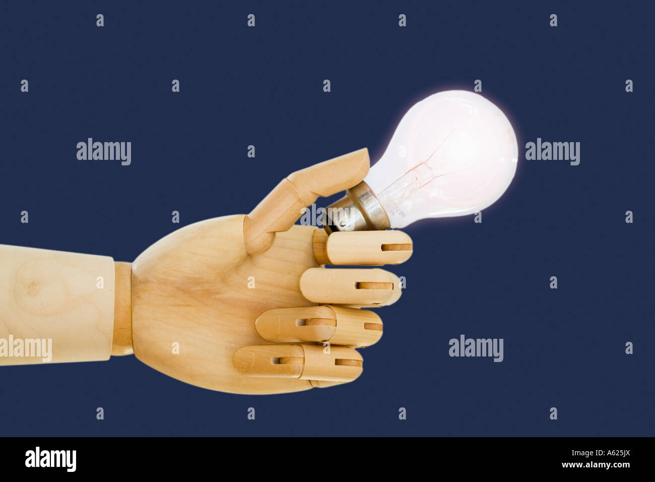 Wooden hand holding lit electric light bulb switch on Stock Photo - Alamy