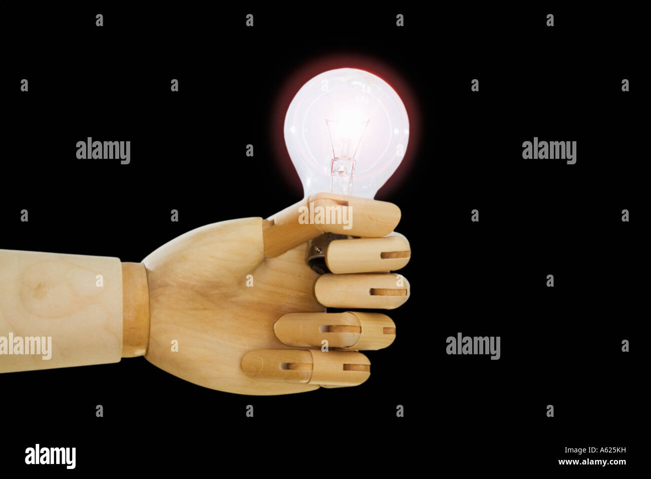 Wooden hand holding lit electric light bulb switch on Stock Photo - Alamy