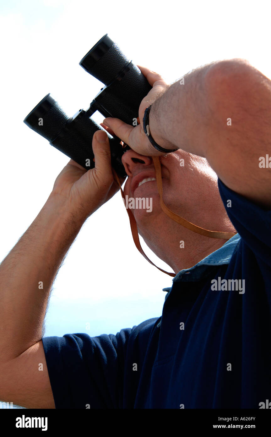 Man with Binoculars Stock Photo - Alamy