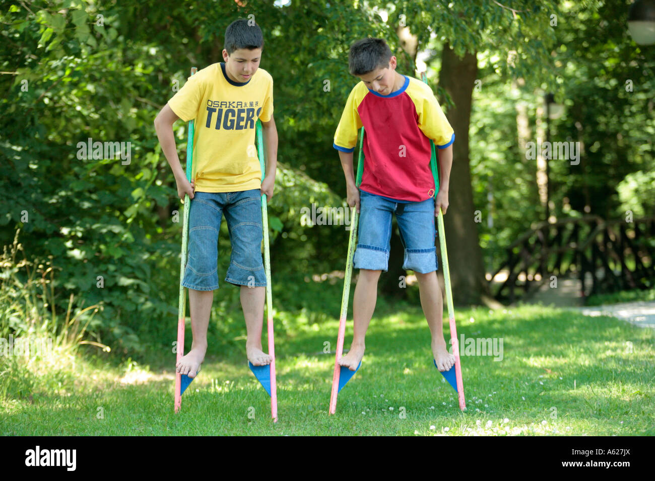 Boys On Stilts Stock Photos & Boys On Stilts Stock Images - Alamy