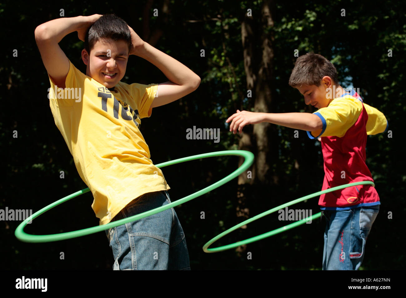 two young boys with hula hoop tyres Stock Photo - Alamy
