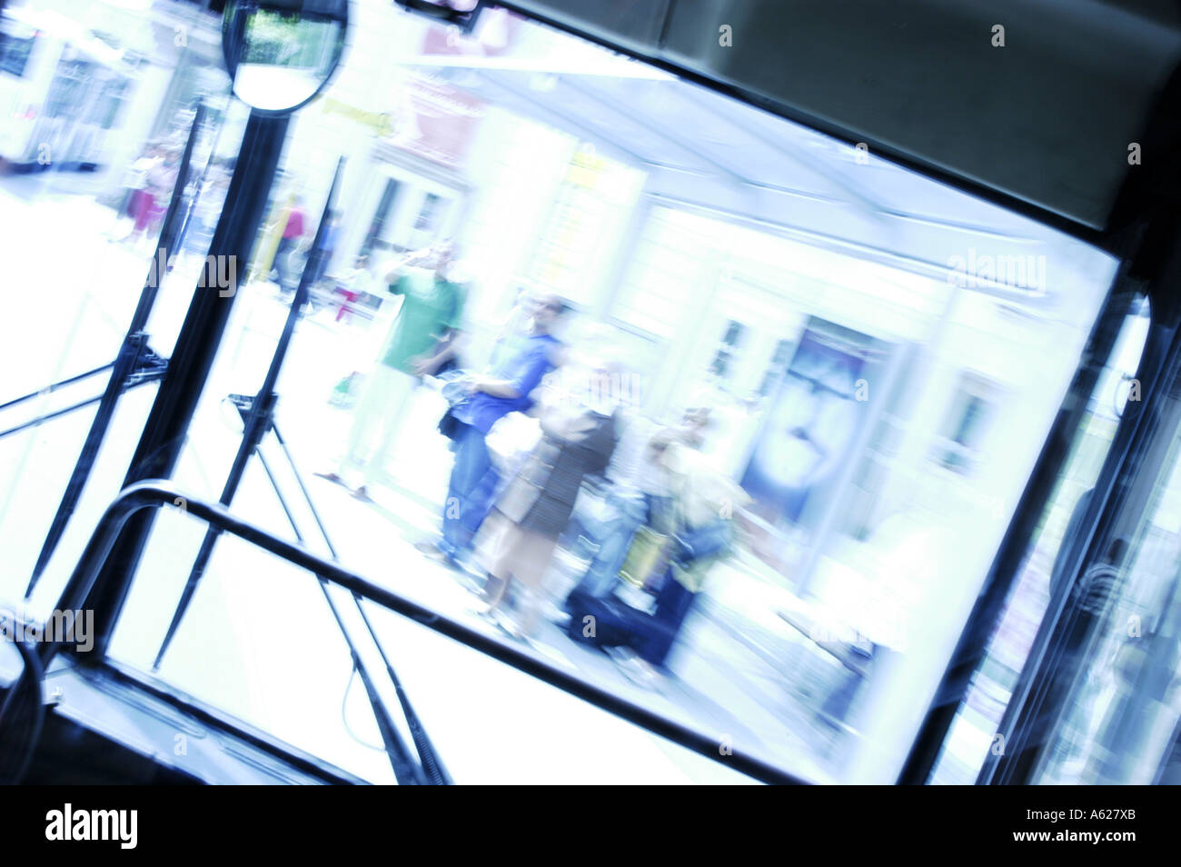 People waiting at bus stop viewed through window bus Stock Photo - Alamy