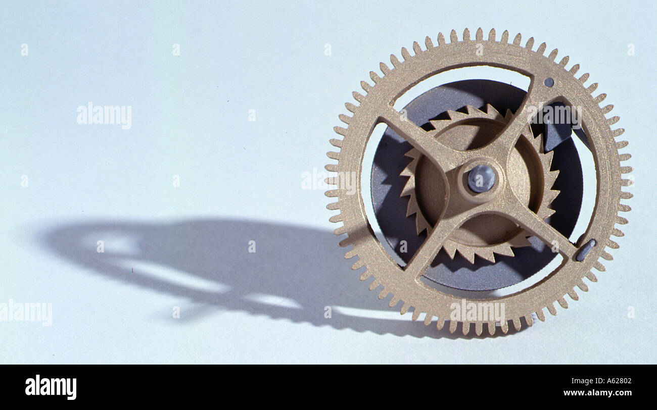 Single gold gear with shadow Stock Photo - Alamy