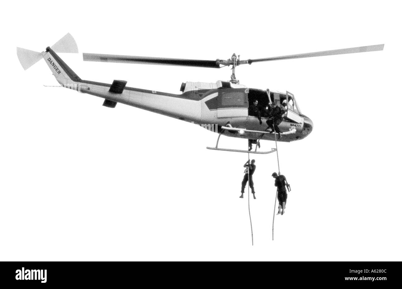 Men drop from helicopter during security operation Stock Photo - Alamy