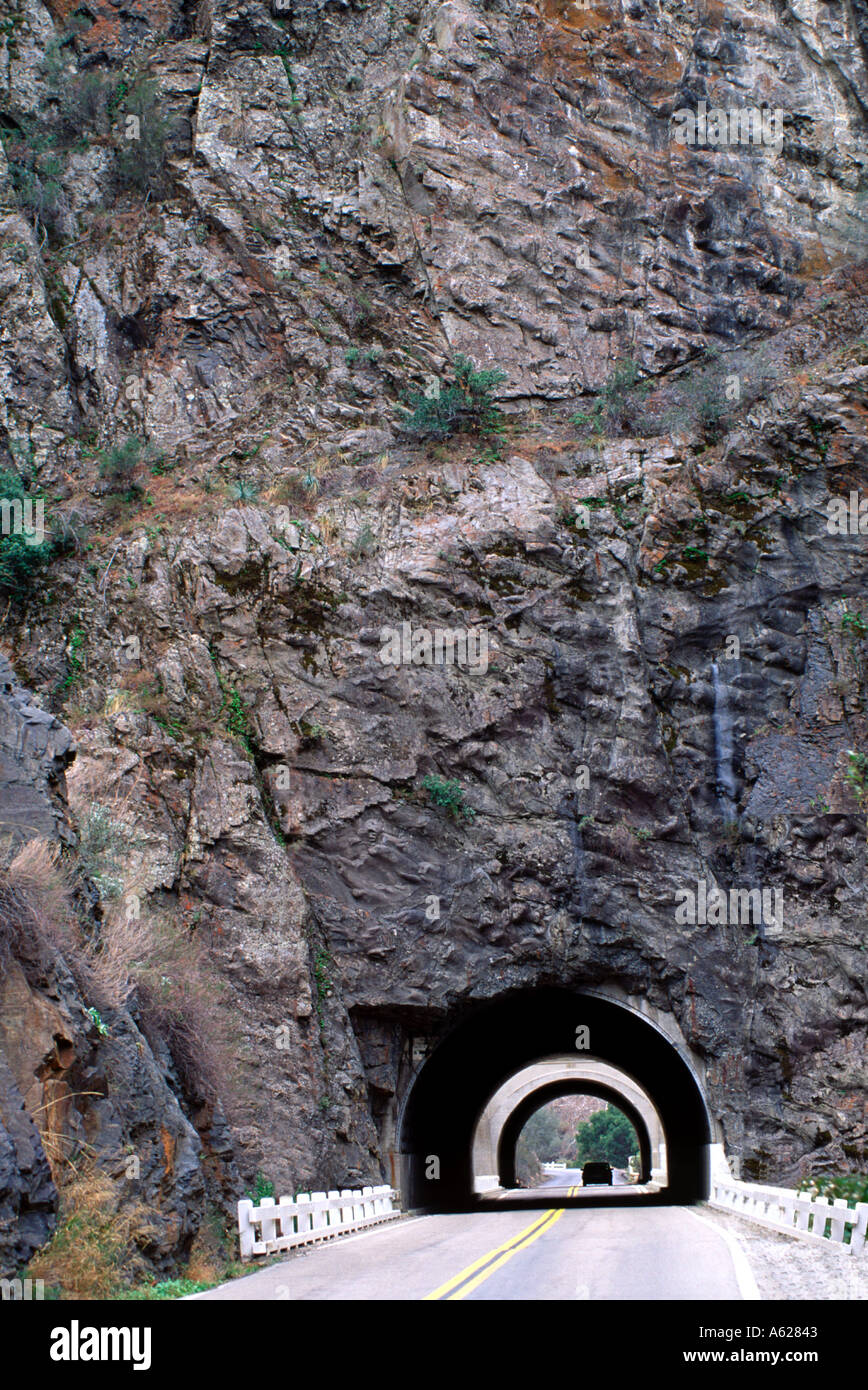 Tunnel cut through rock Stock Photo - Alamy