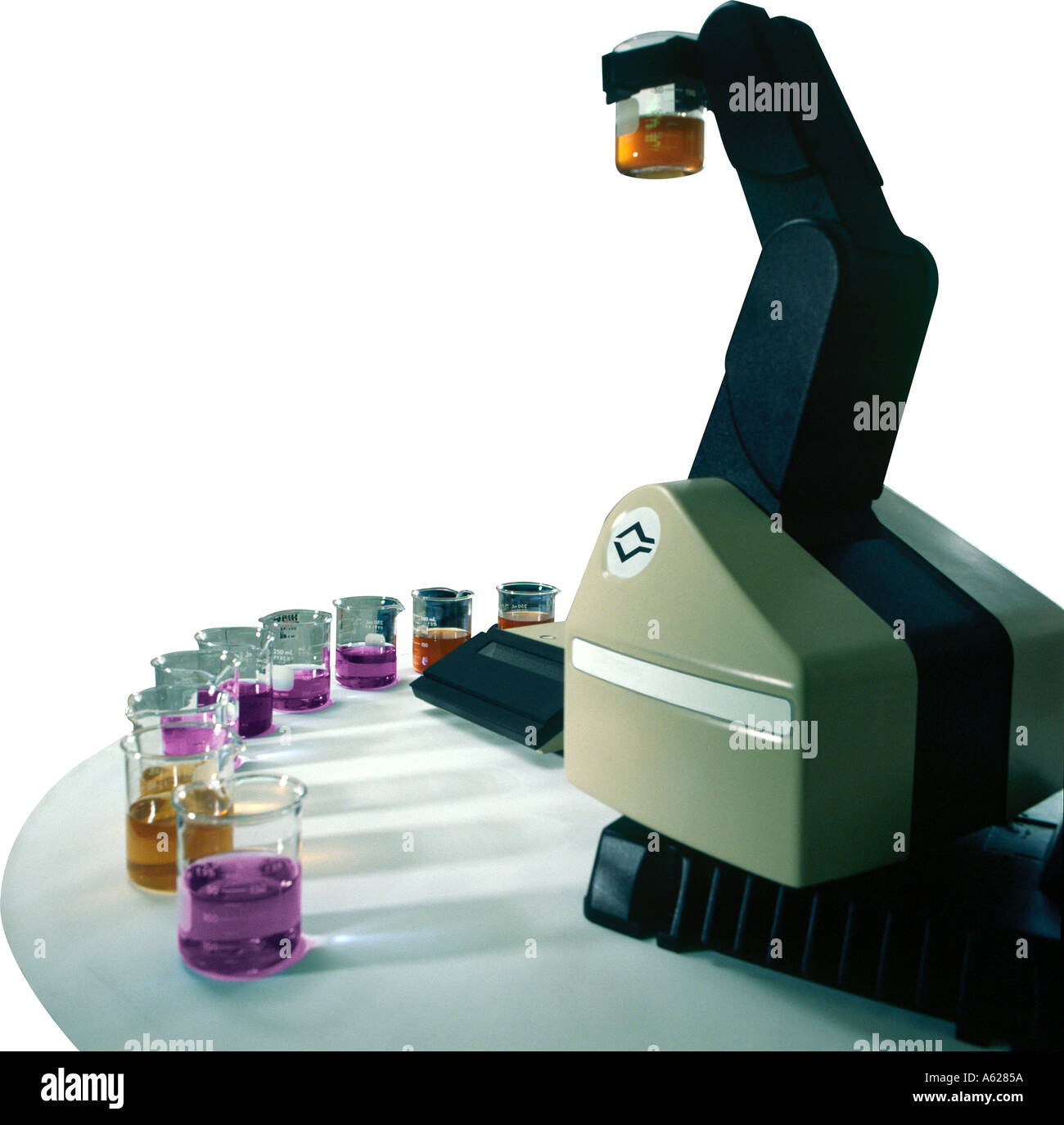 Robotic arm and table with beakers Stock Photo - Alamy
