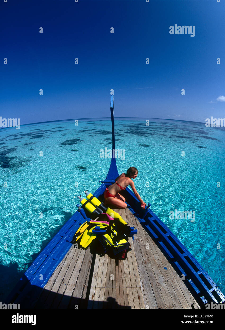 Woman in a boat with scuba diving gears Maldives Stock Photo - Alamy