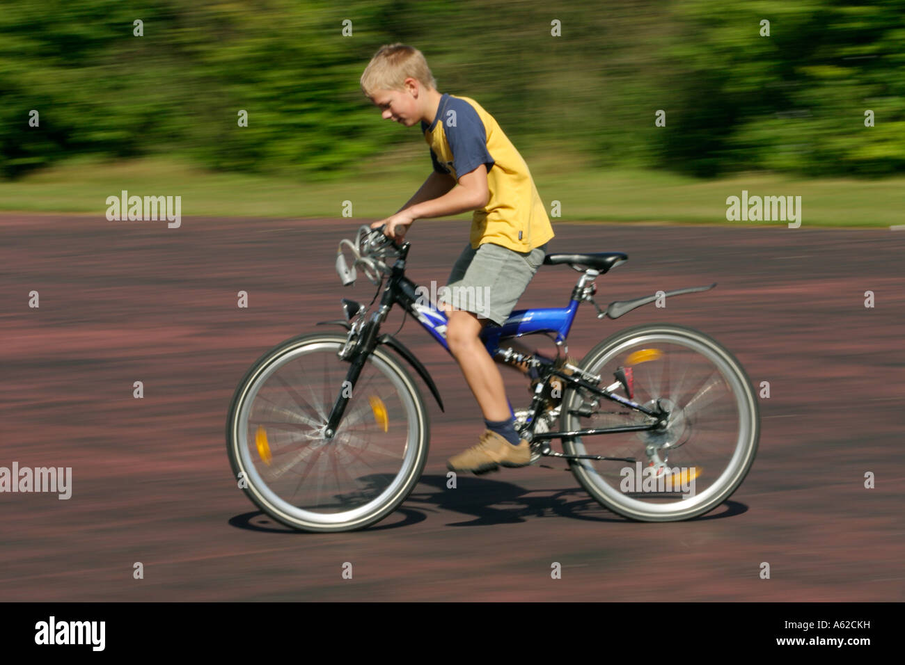 young boy on a bike Stock Photo - Alamy