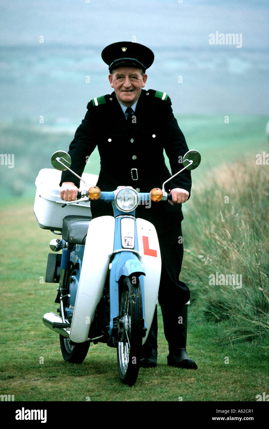A portrait of a local policeman in a small town in Scotland walking ...