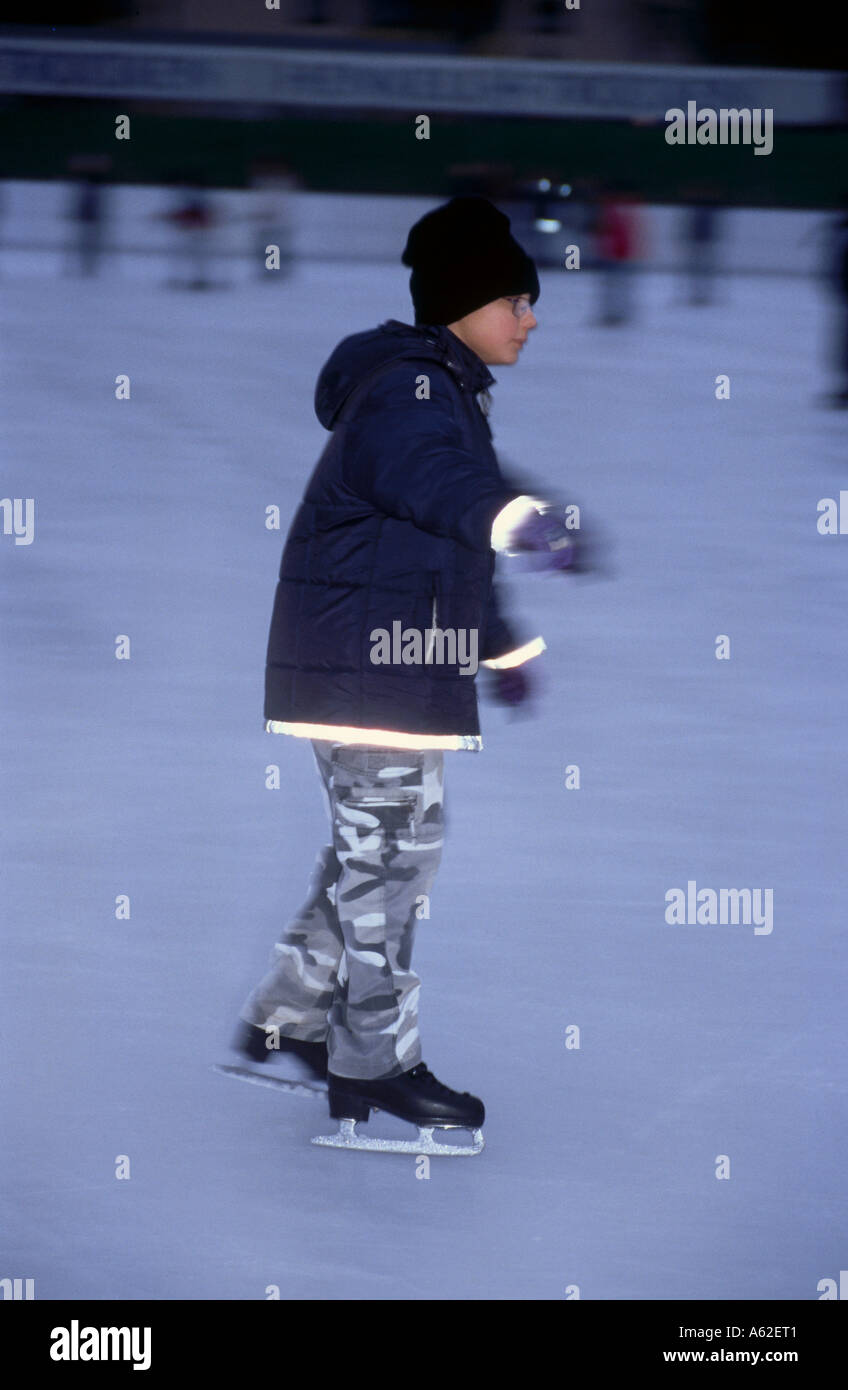 Side profile of boy ice skating Stock Photo - Alamy