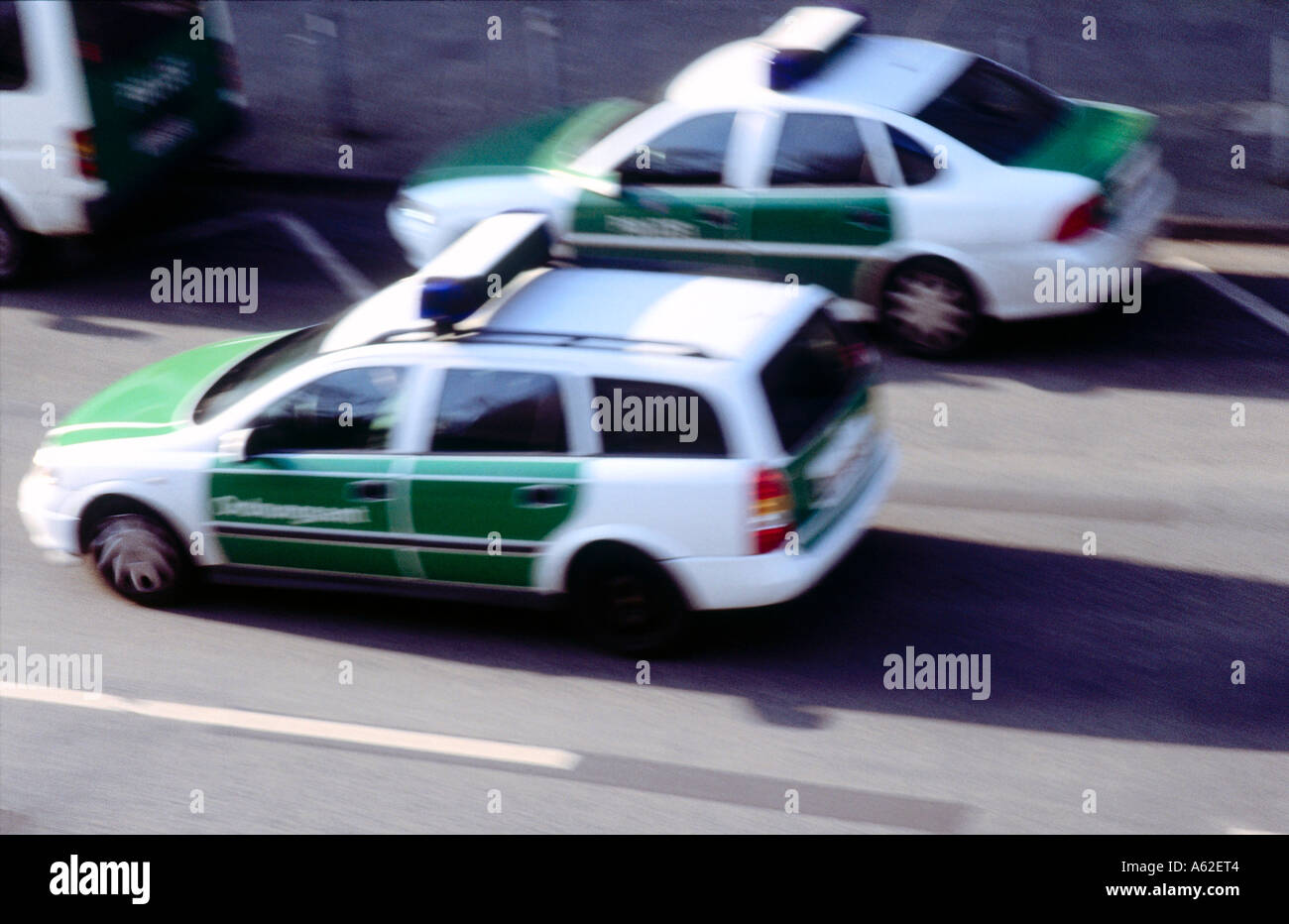 High angle view of two cars on road Stock Photo - Alamy