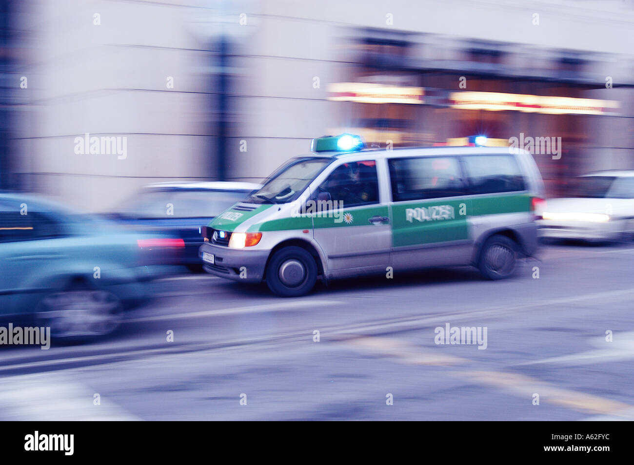 Blurred view of police car on road Stock Photo - Alamy