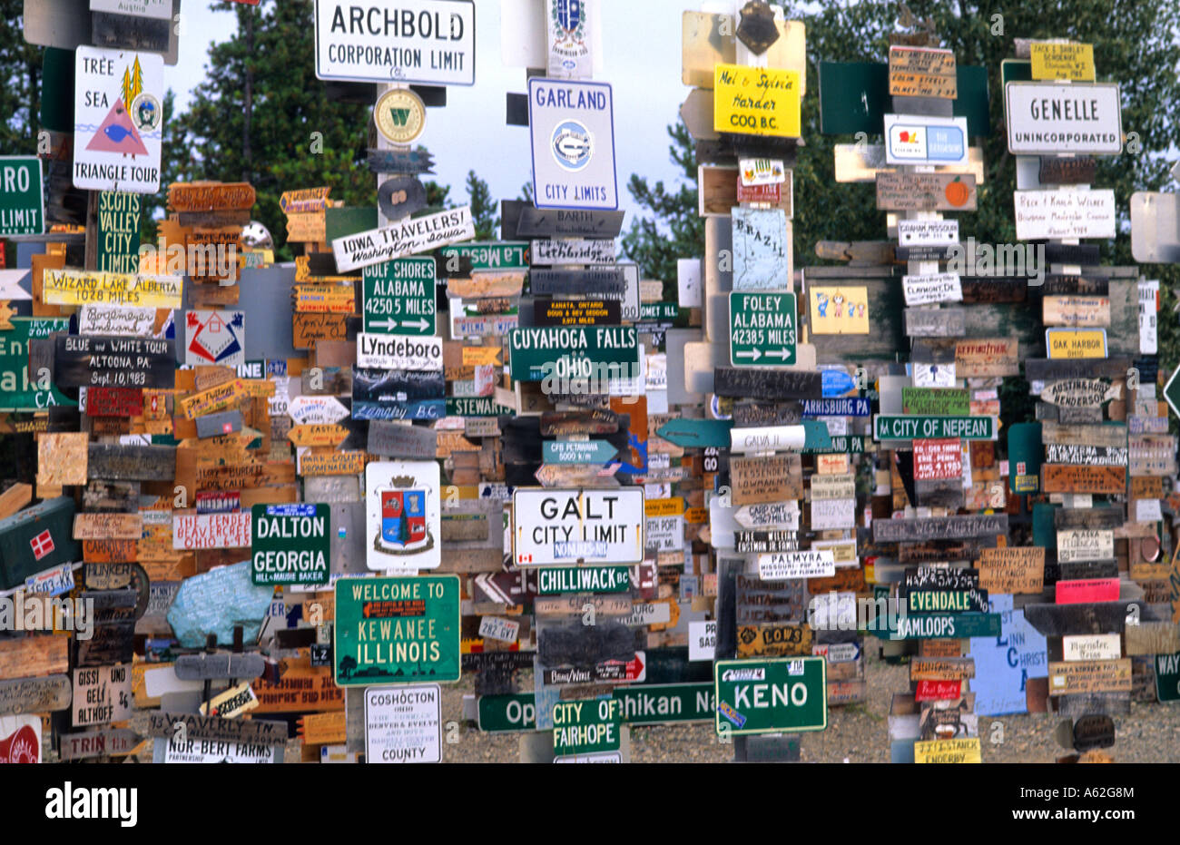 Famous 25 000 town sign post forest in Watson lake Yukon Canada Stock ...