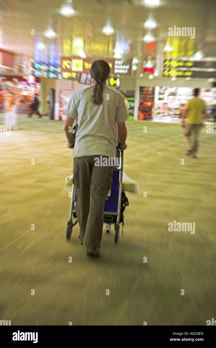 Asian man pushing trolley hi-res stock photography and images - Alamy