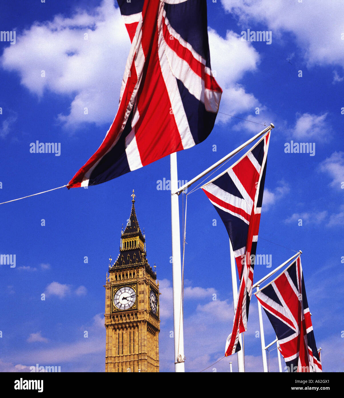 Low angle view of clock tower and flags of France, London, France ...
