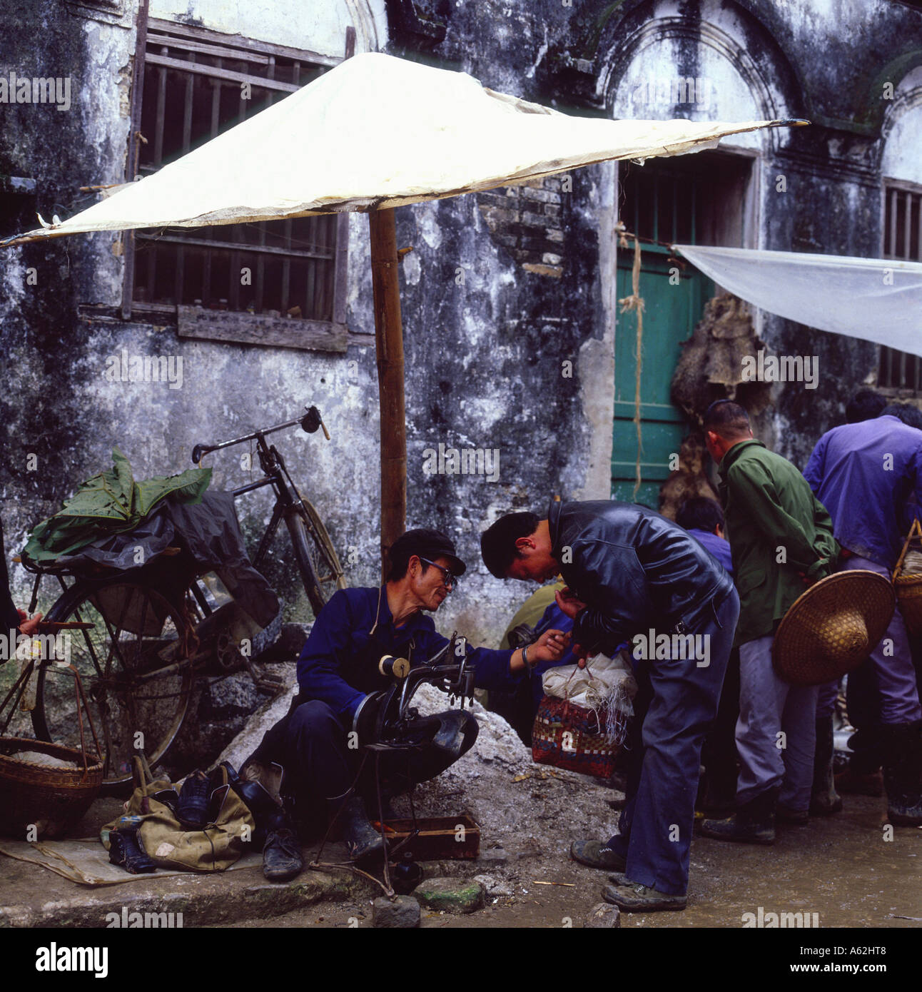 Craftsman at street market China Stock Photo - Alamy